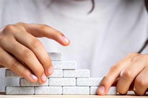 Premium Photo Woman Assembling Brick Game