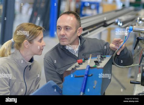 Man And Woman With Machine Cnc Stock Photo Alamy
