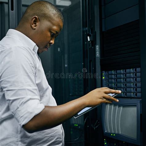 Server Room Black Man Or Technician With Tablet For Online Cyber Security Glitch Or Software