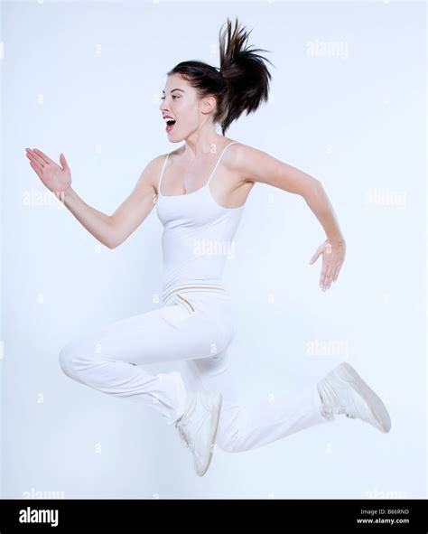 Beautiful Young Woman On Isolated Background Doing Her Workout Stock