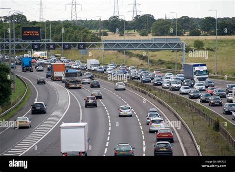 Variable Speed Limit Section Of The M42 Showing Traffic Using The Hard Shoulder In Attempt To