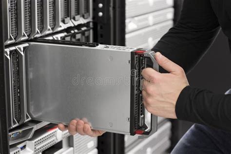 it engineer insert a blade server in data center stock image image of