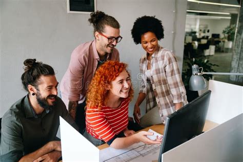 Group Of Business People And Software Developers Working As A Team In