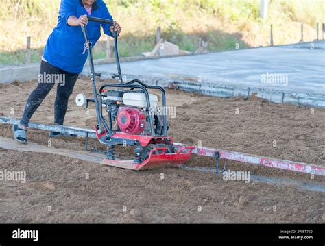 Vibrating Soil Compactor Used To Compact Soil In Preparation For