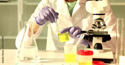 Urine Sample Medical Analysis Scientist Stirs Analysis In Beaker Urine Sample For Laboratory