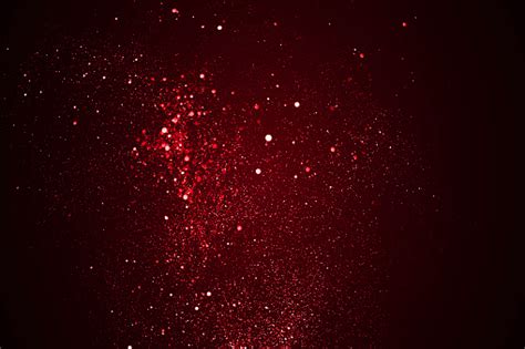 크리스마스 레드 스파클 반짝이 폭발 먼지 입자 배경 Bokeh 휴일 행복 한 새 해와 발렌타인 날 사랑 관계 0명에 대한 스톡