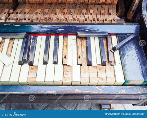 A Fragment Of The Keyboard Of An Old Broken Piano With Broken Keys And No Cover Closeup Photo