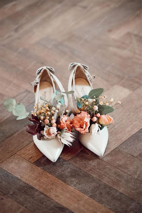 Premium Photo Bridal Shoes With Flowers On Wooden Floor