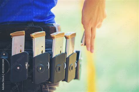 Gun Magazine At The Waist Of The Women Are Picked To Use As A Background Blurred Stock Photo