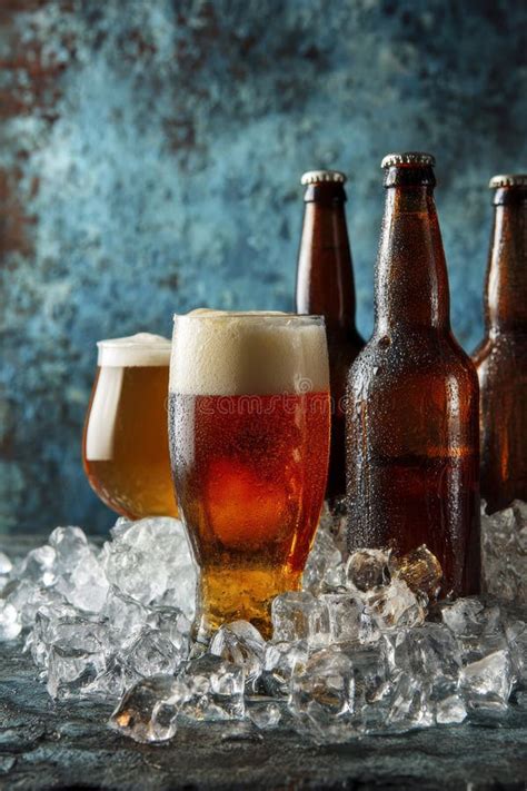 Refreshing Ice Cold Beers In Glasses With Chill Bottle Background Stock
