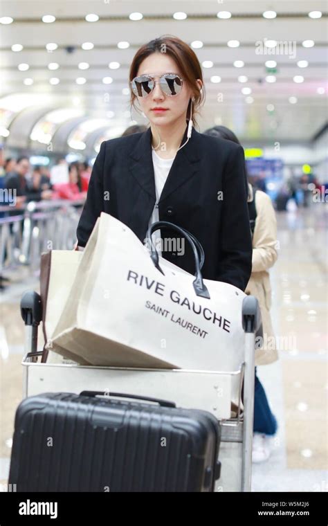 Chinese Actress Huang Mengying Or Maggie Huang Arrives At The Beijing Capital International