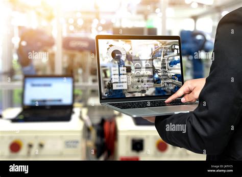 Engineer Hand Using Laptop With Machine Real Time Monitoring System Software Blur Automation