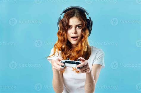 Woman In Headphones With A Joystick In Her Hands Plays Video Games