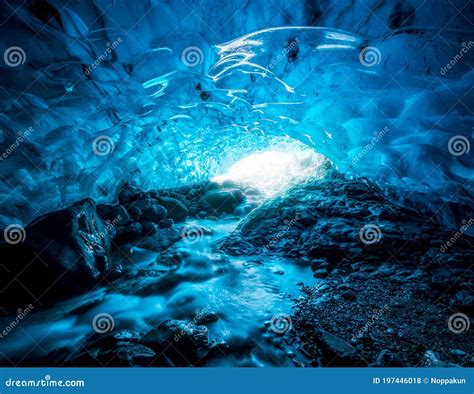 Entrance Of An Crystal Blue Ice Cave With Underground River Inside