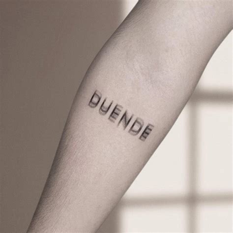 Duende Anaglyph Lettering Tattoo Located On The Inner