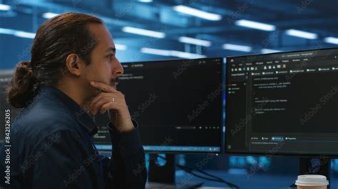 Computer Scientist In Server Hub Doing System Analysis Coding Doing Needed Adjustments For