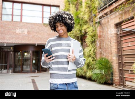 A Mixed Race Woman With Vitiligo Is Happily Checking Her Phone While