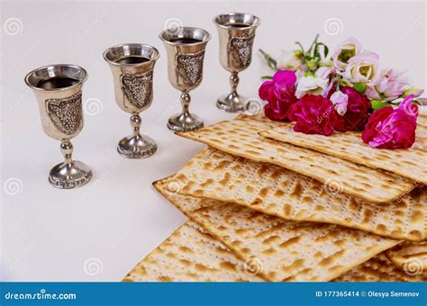 Jewish Matzah Bread On Wooden Background With Four Wine Cups And