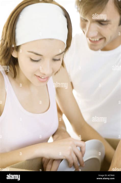 Couple Unpacking Box Stock Photo Alamy