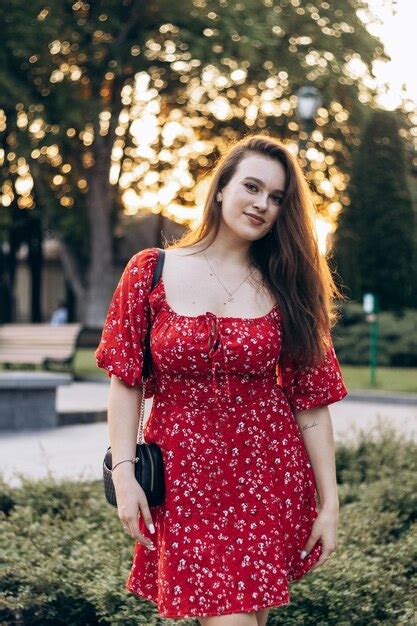 Premium Photo Girl Walks In Park In Red Dress In Evening On Summer Day