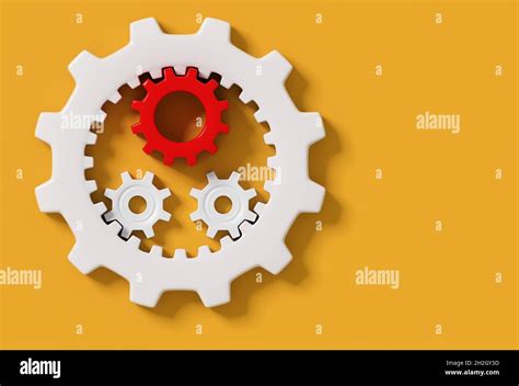 Small Red And White Connecting Gear Cogs Inside Big White Cog Isolated On Yellow Background