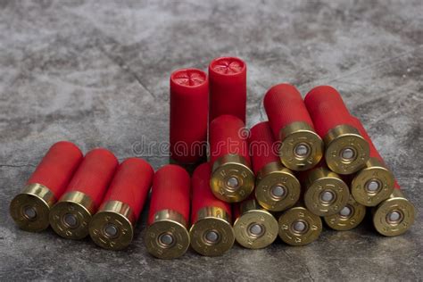 12 Gauge Red Shotgun Shell Ammunition On Texture Background Stock