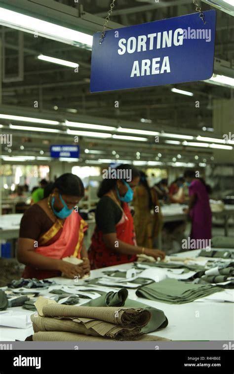 Woman Sorting Clothes Stock Photo Alamy