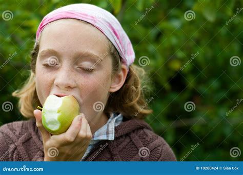 Girl Enjoying An Apple Stock Photo Image Of Fresh Pretty