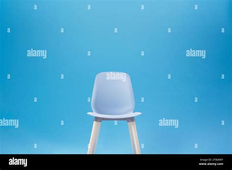 blue classic chair on the blue backdrop for chroma key technique in the