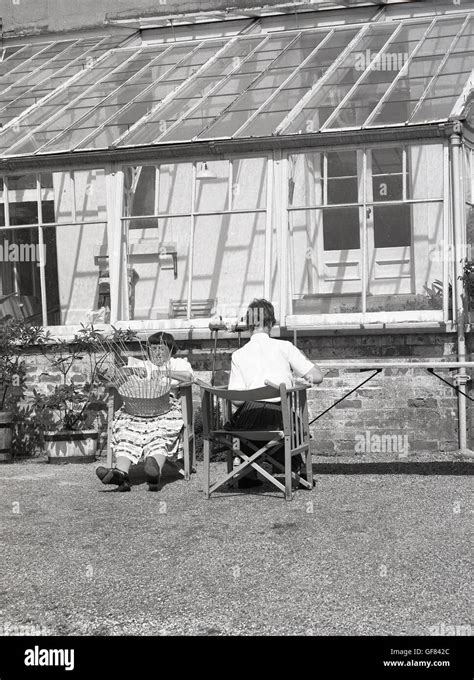 1950s Historical Elderly Lady In Nursing Home Outside Making Basket