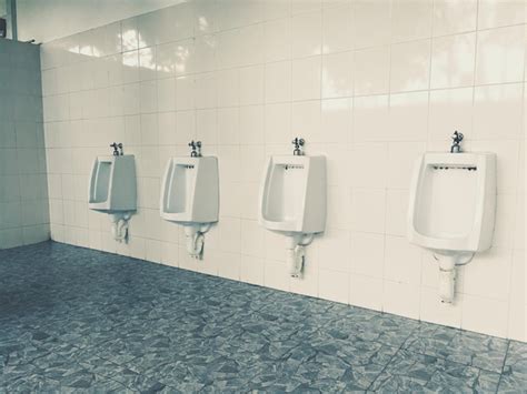 Premium Photo Row Of Objects On Tiled Floor Against Wall