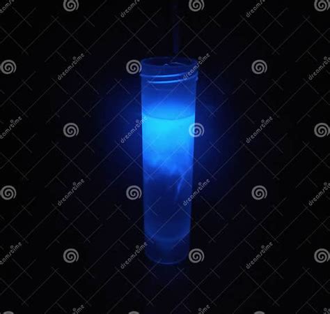 Blue Glowing Liquid In A Glass Tube On A Dark Background Vibrant And