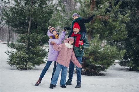 Photo Of Funky Excited Husband Wife Small Kid Wear Windbreaker Riding Shoulders Having Fun