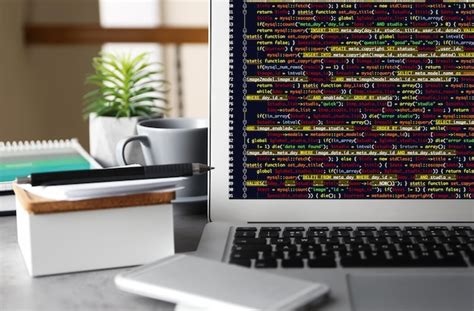 Premium Photo Laptop Of Programmer With Script Code On Display