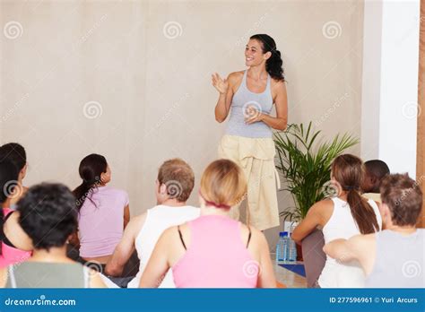 Her Enthusiasm Motivates Her Class A Group Of People Sitting On Their