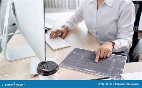 Young Asian Woman Programmer Typing Code Working With Computer At Table