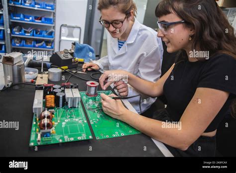 Engineers Soldering Circuit Board Together In Electronics Industry Stock Photo Alamy