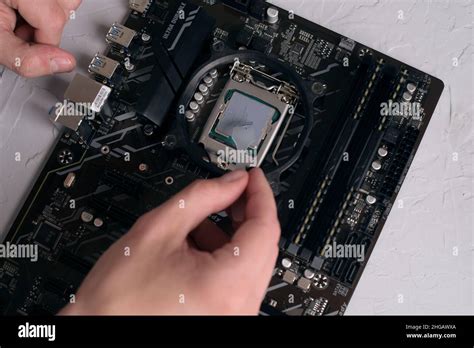 Engineer Plugging Cpu Microprocessor To Motherboard Socket Computer Technology Hardware