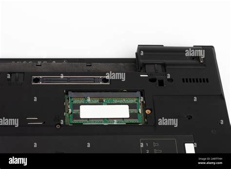 Close Up Of Laptop Memory Module On Slot Of Motherboard Underside Of The Notebook On White