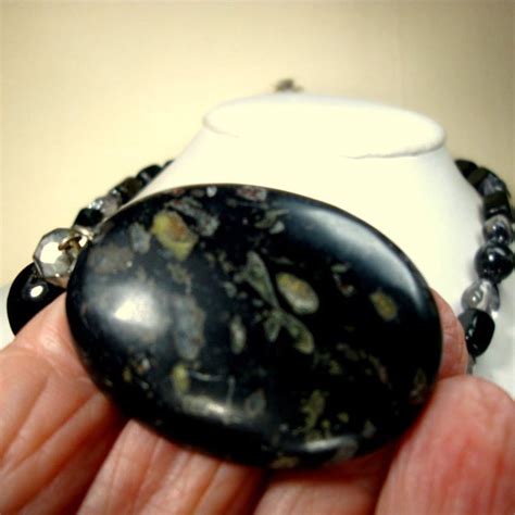 Black Fossil Stone Pendant On Beaded Necklace Of Black Stone Etsy