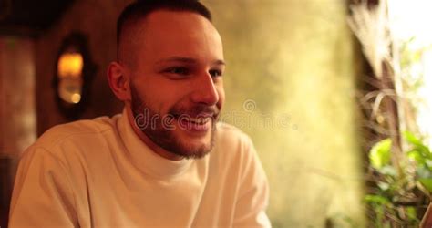 A Handsome Young Guy Is Sitting At A Cafe Table On A Romantic Date Stock Footage Video Of