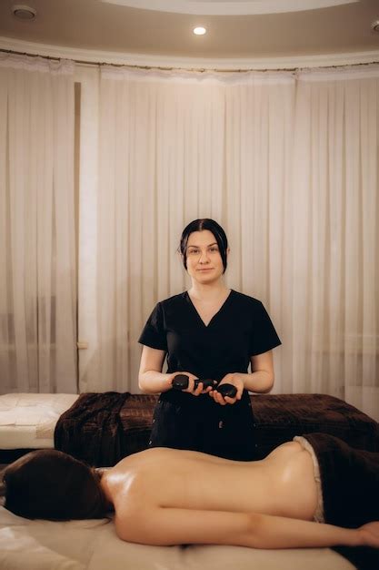 Premium Photo Stone Therapy Massage With Hot Basalt Stones Focus On