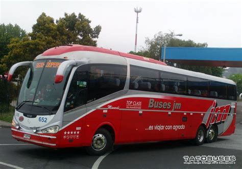 Red And White Bus On The Streets Of Concepcion
