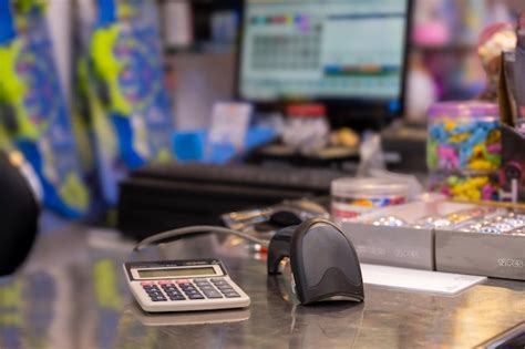 Premium Photo Qr Code Scanner On Table With Calculator With Casheer Screen In The Background