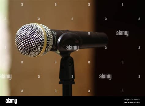 Closeup Shot Of Dynamic Vocal Singing Microphone Attached On The Stand