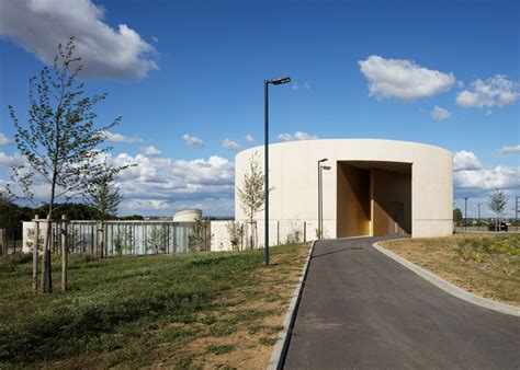 Plan 01s Crematorium Is Covered In Ribbed Concrete And Glass