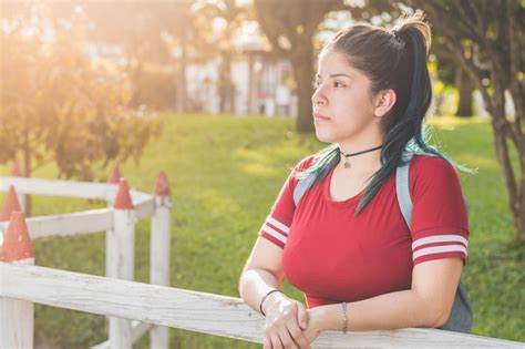 Premium Photo Beautiful Young Latina College Girl Pensive Dressed In