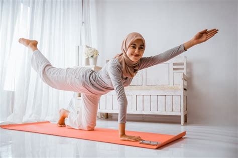 Muslim Woman Instructor Wearing Hijab Doing Yoga Pilates Pose On
