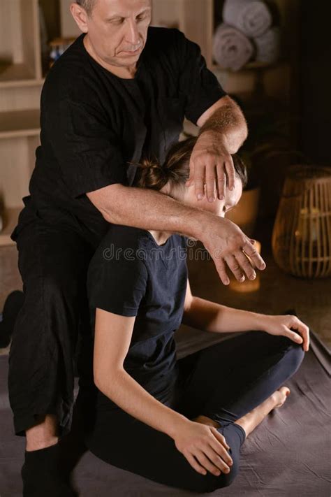 Client In Thai Massage Session With Therapist A Man Giving A Thai Neck