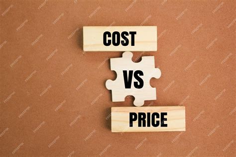 Premium Photo Wooden Puzzle With The Words Cost Vs Price The Concept Of Calculation Management